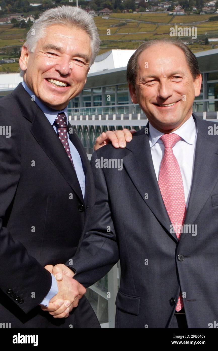 Nestle's Chairman and CEO Peter Brabeck-Letmathe, left, shakes hands ...