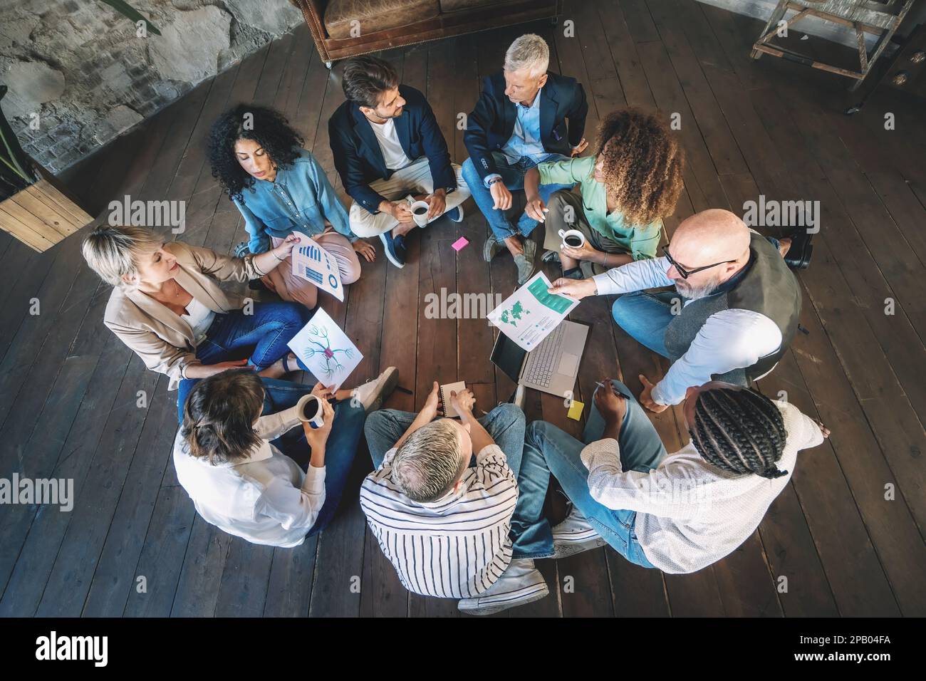 A diverse group of professionals engages in a creative brainstorming ...