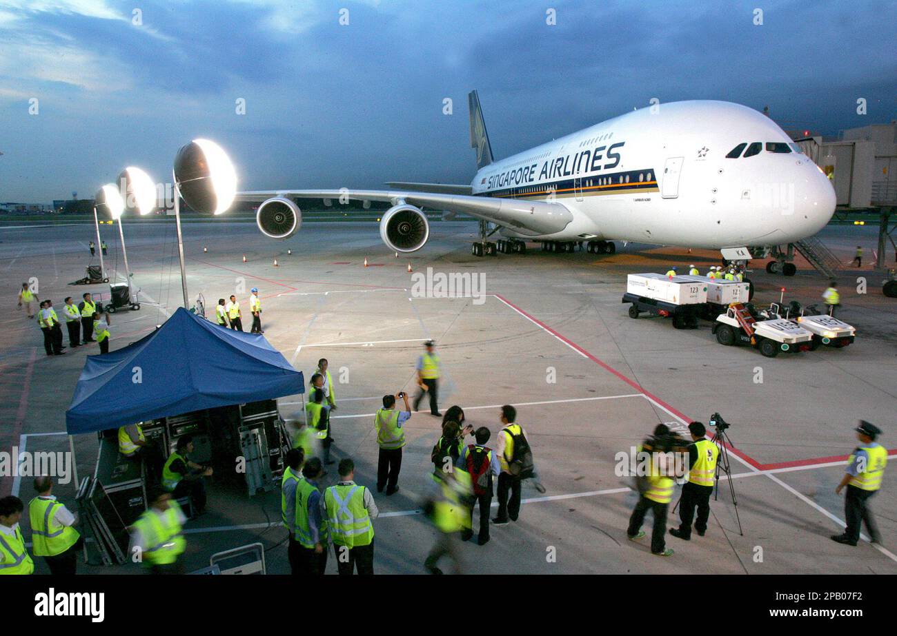 Singapore Airline's Airbus A380 is lit with soft lighting as it parks ...