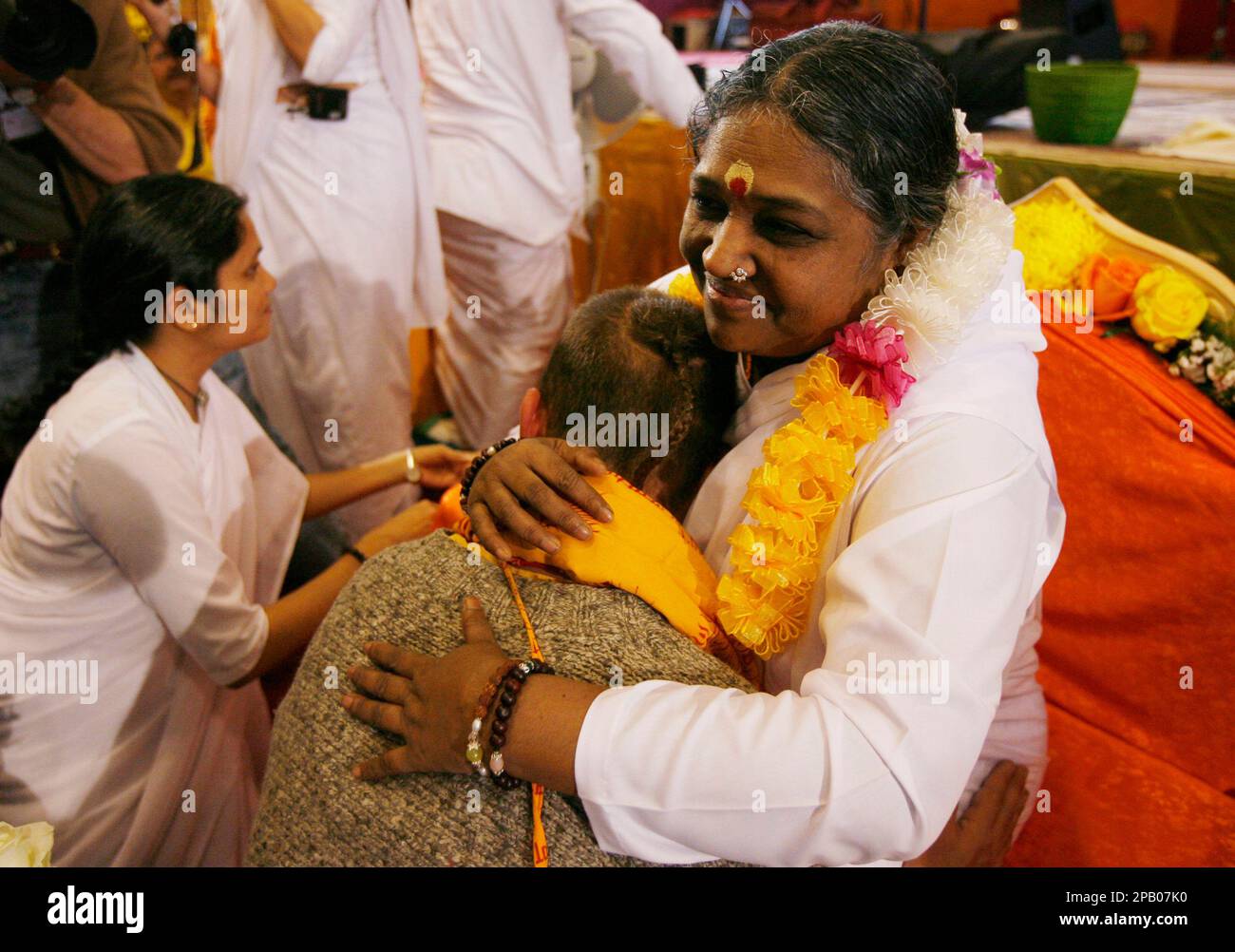 India's most famous woman guru, Sri Mata Amritanandamayi Devi, hugs a ...