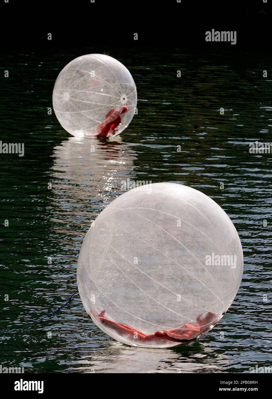 Two of six inflatable water sculptures float on the Four Point Channel ...