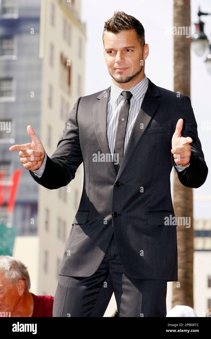 Singer Ricky Martin poses for his fans as he is honored star on the ...