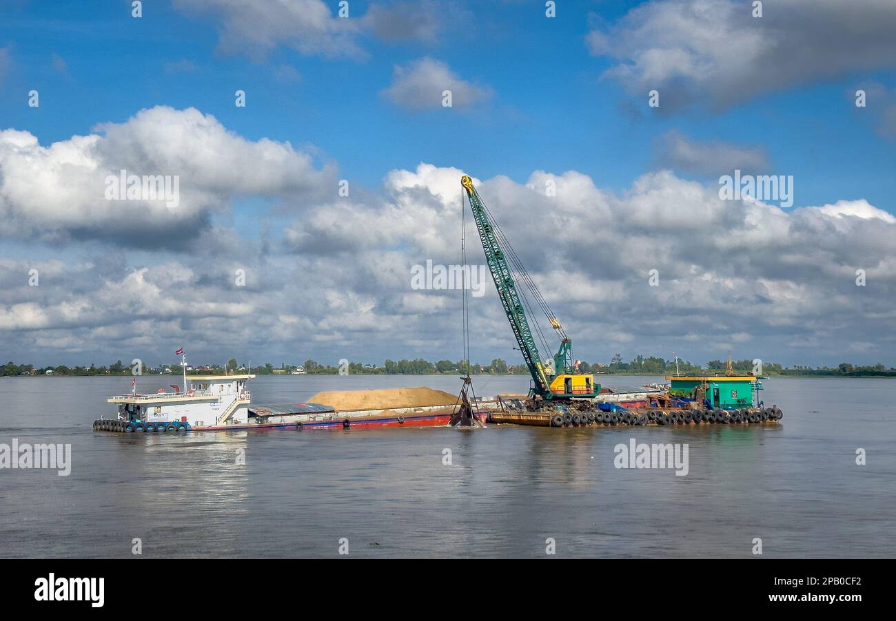A floating dredger on the Mekong River in Kandal province, Cambodia ...