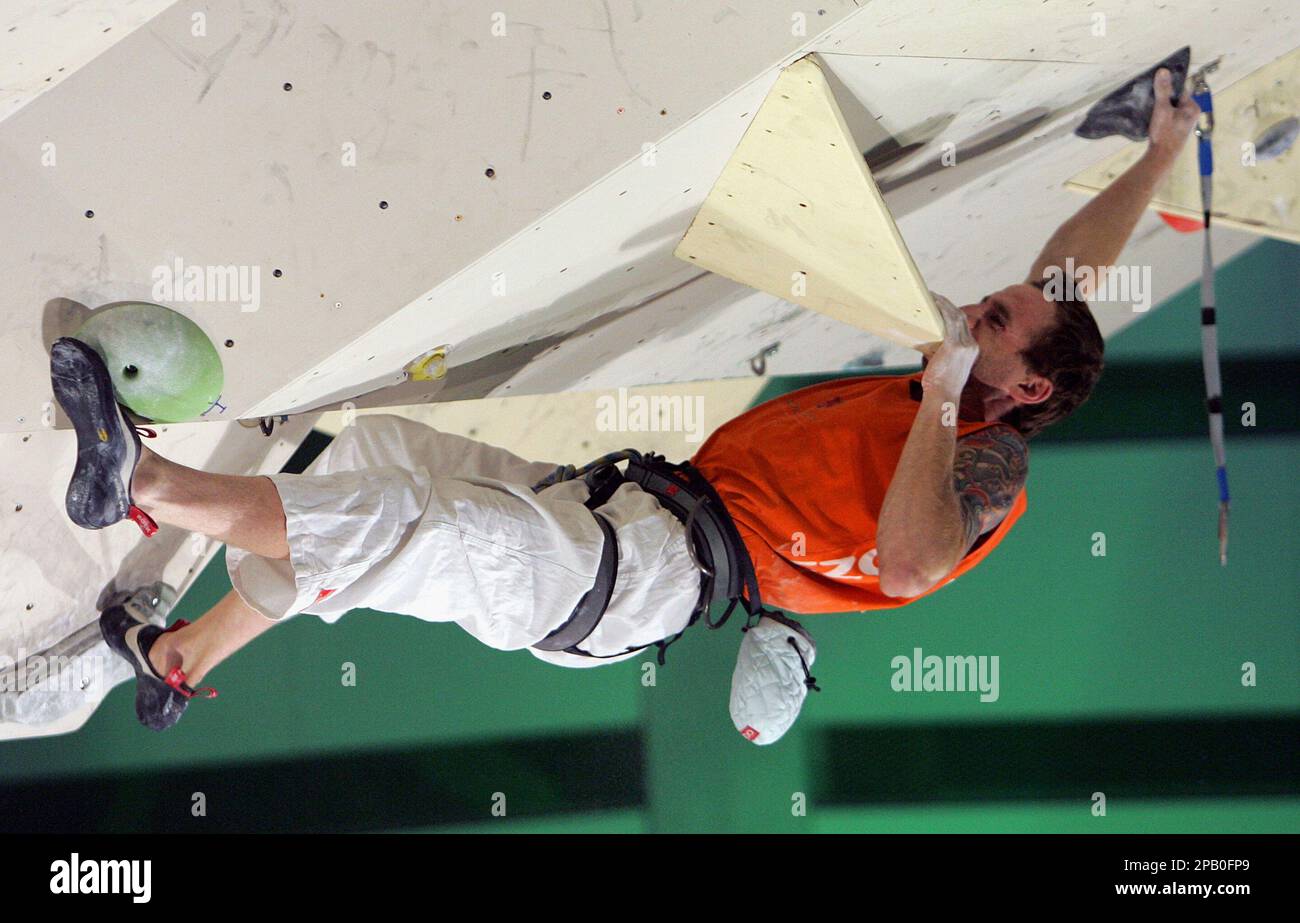 Czech Republic's Tomas Mrazek climbs a wall on the way to winning the ...