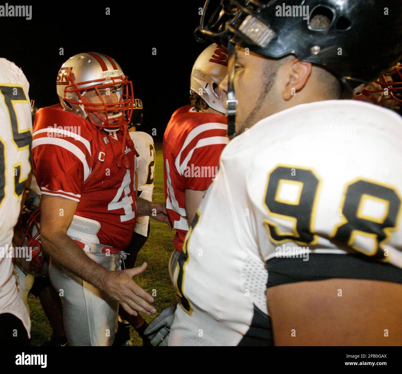 Sul Ross State linebacker Mike Flynt, left, shakes hands with Texas ...