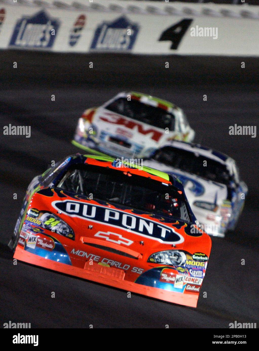 Jeff Gordon, front, leads cars through turn four during the NASCAR ...