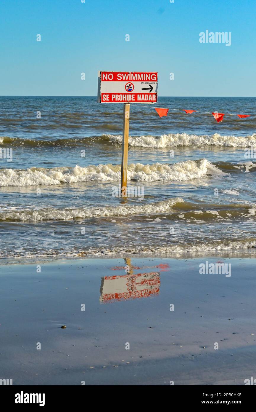 Galveston, Texas, USA - February 2023: Warning sign on ther water's ...