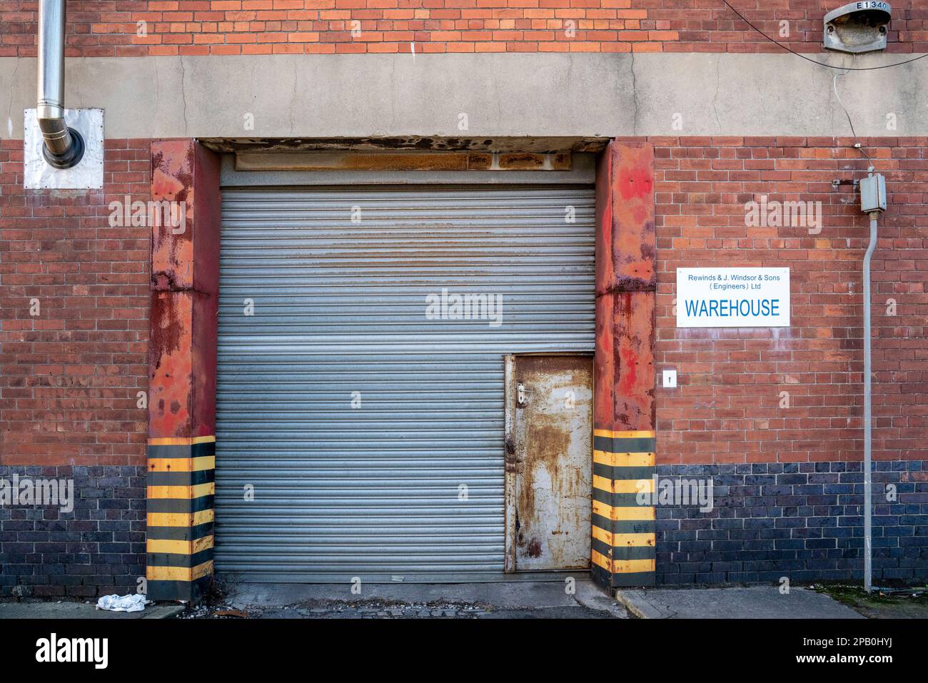 Metal shutter to warehouse loading bay Stock Photo - Alamy