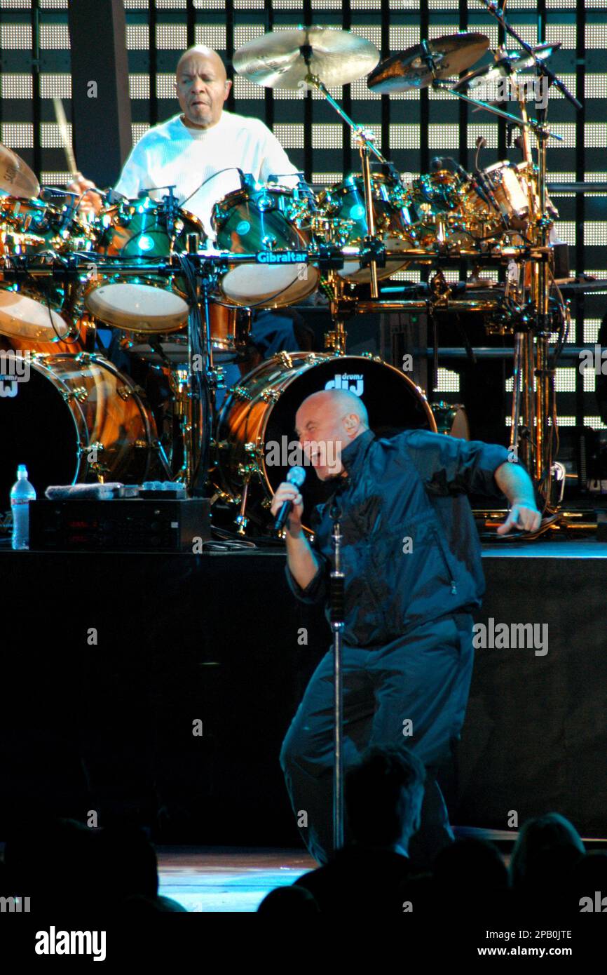 Chester Thompson on the drums and Phil Collins of Genesis perform on ...