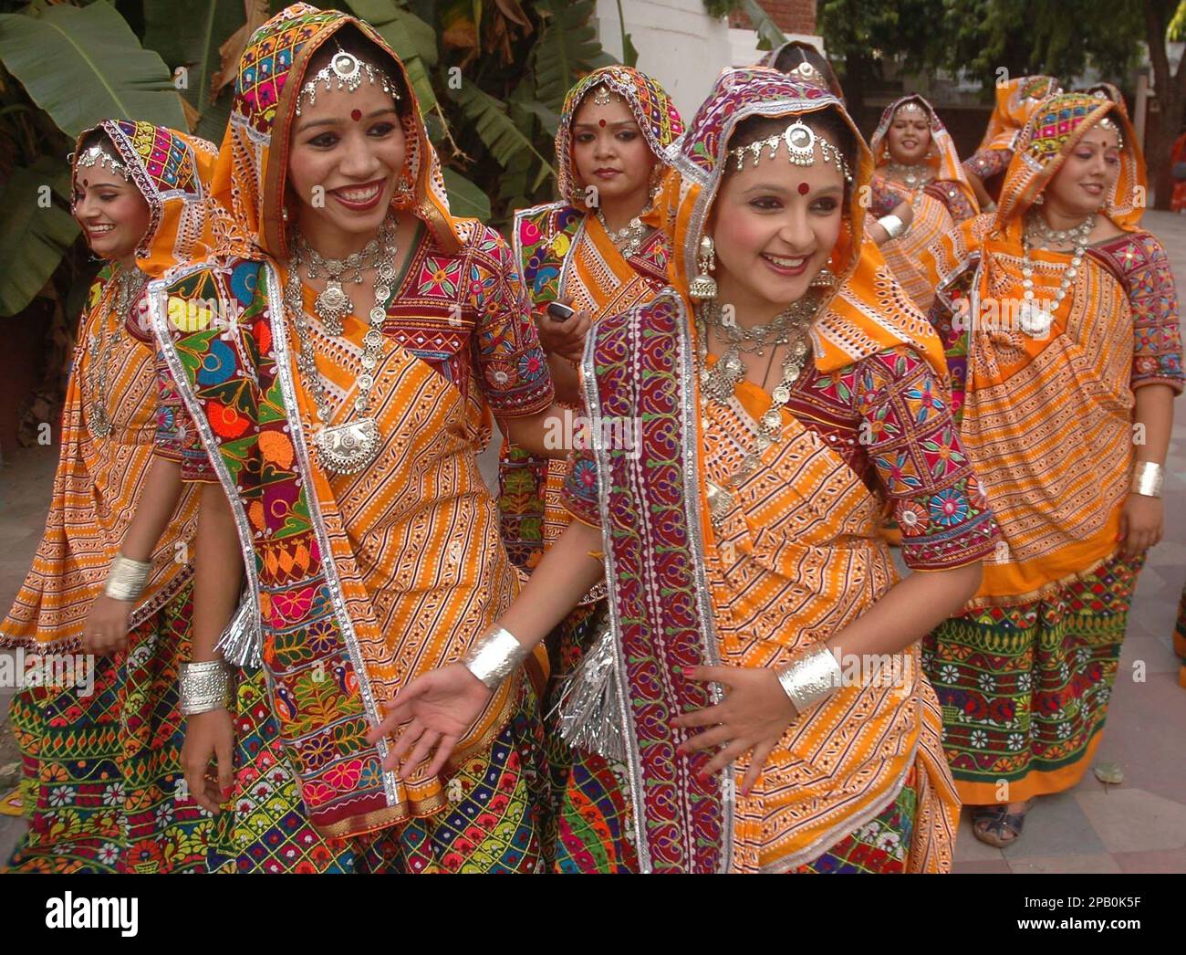 Students, wearing traditional costumes arrive to participate in an ...