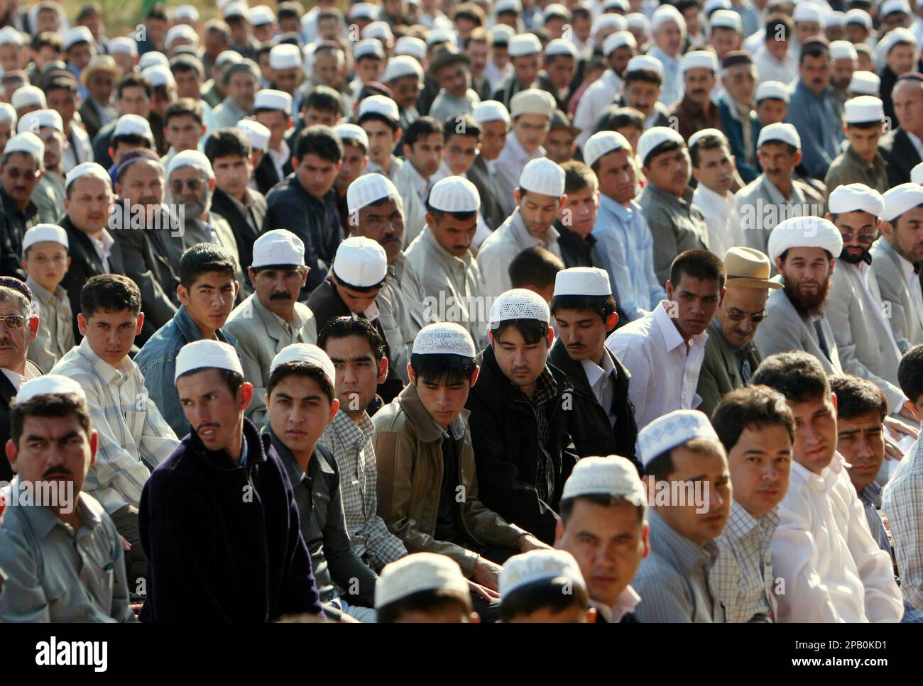 Iranian Sunni Muslim men pray during Eid al-Fitr, the end of the Muslim ...