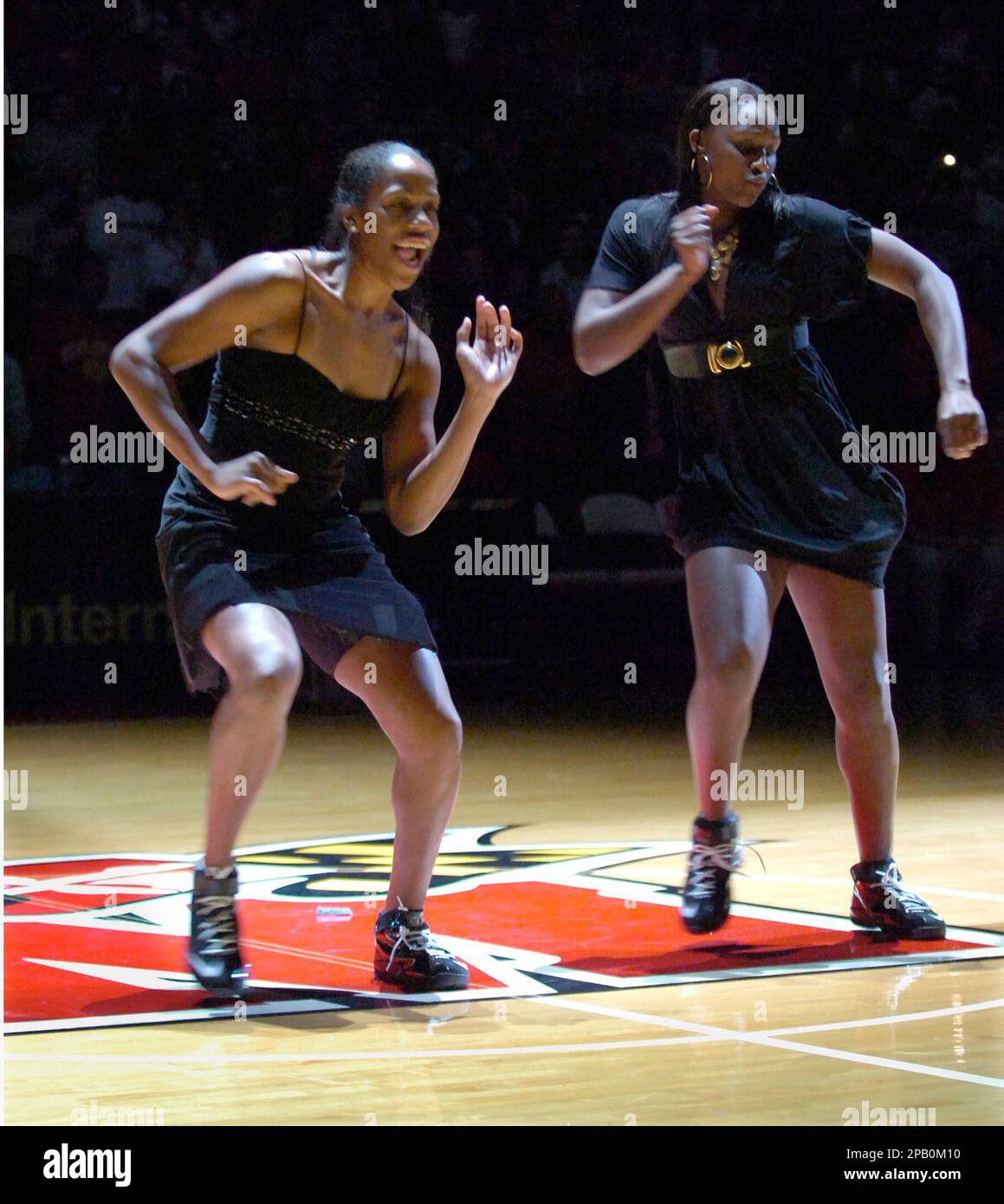 Members of the women's basketball team including Laura Harper, left and ...