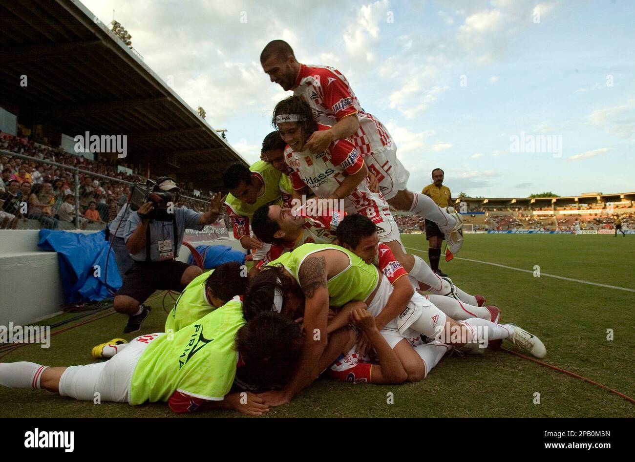 Tecos' players celebrate their first goal against Santos at a Mexico ...