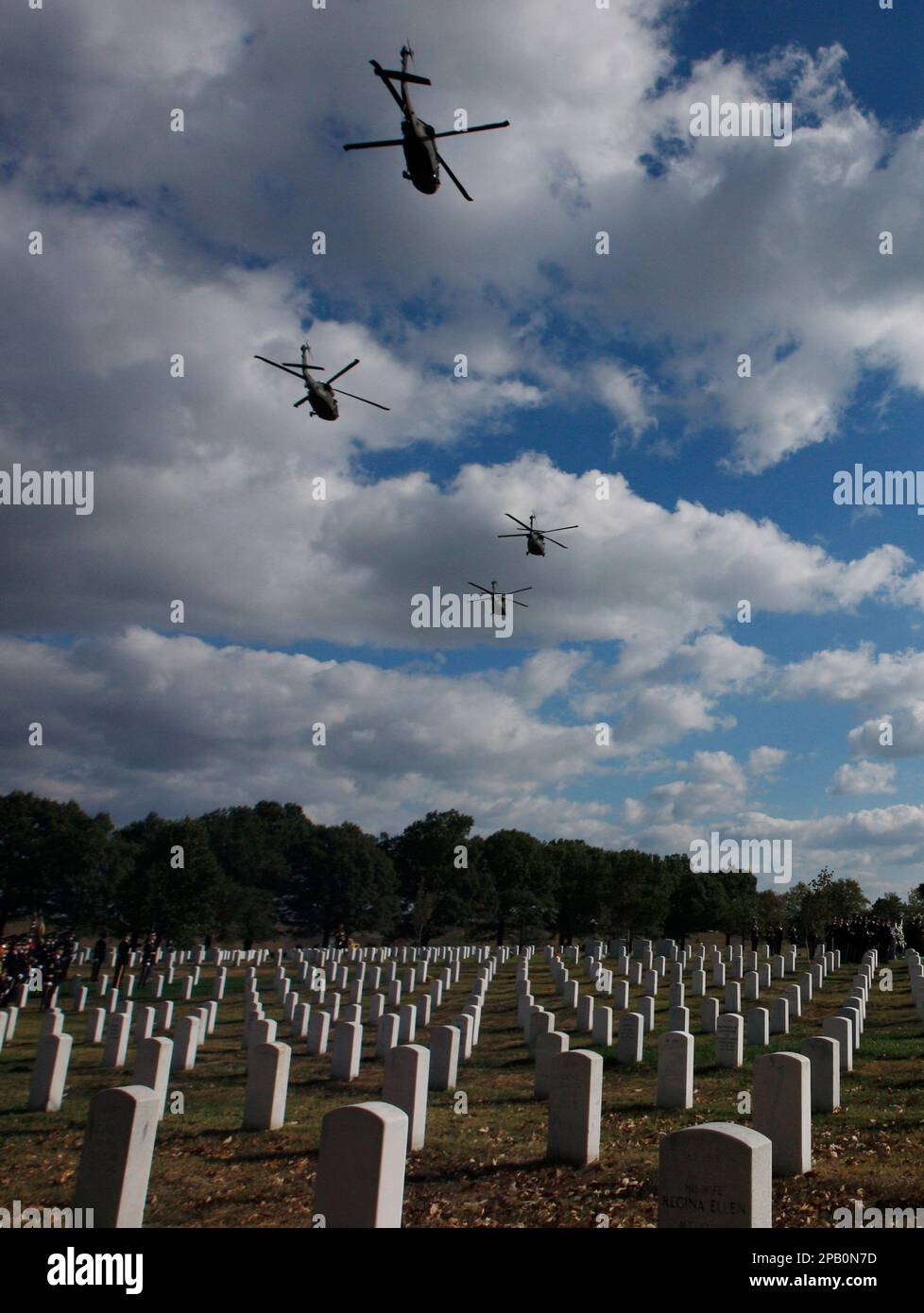 Helicopters fly over Arlington National Cemetery in Arlington, Va ...