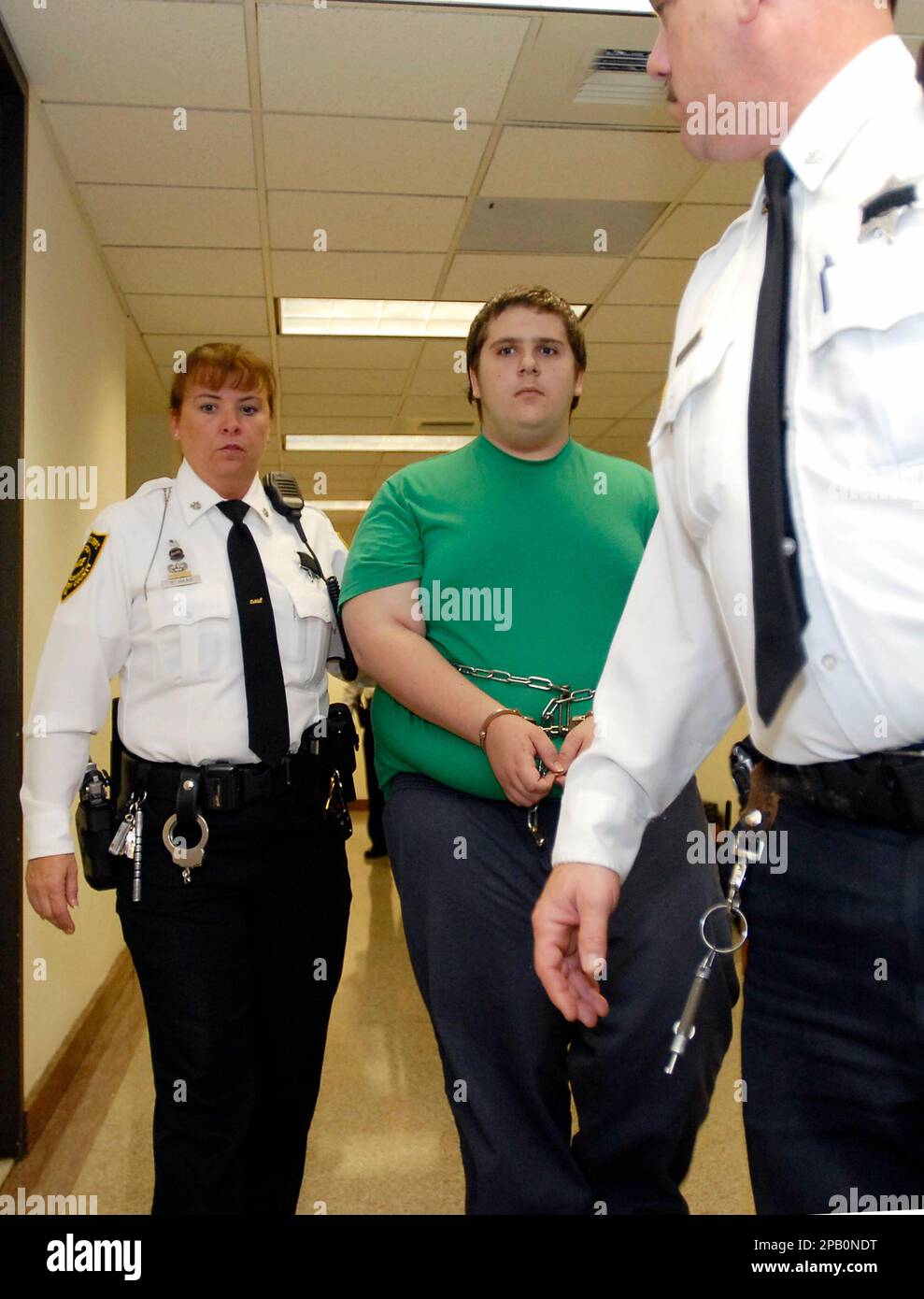 Dillon Cossey, 14, is returned to his cell from the courtroom at the ...