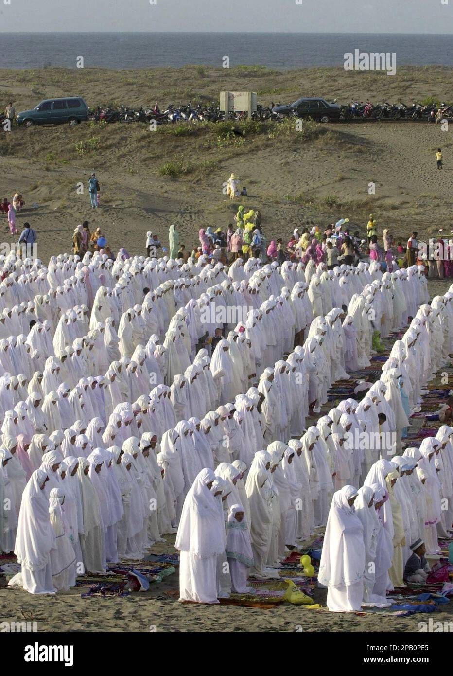 Muslim women attend a morning prayer marking the start of the Islamic ...