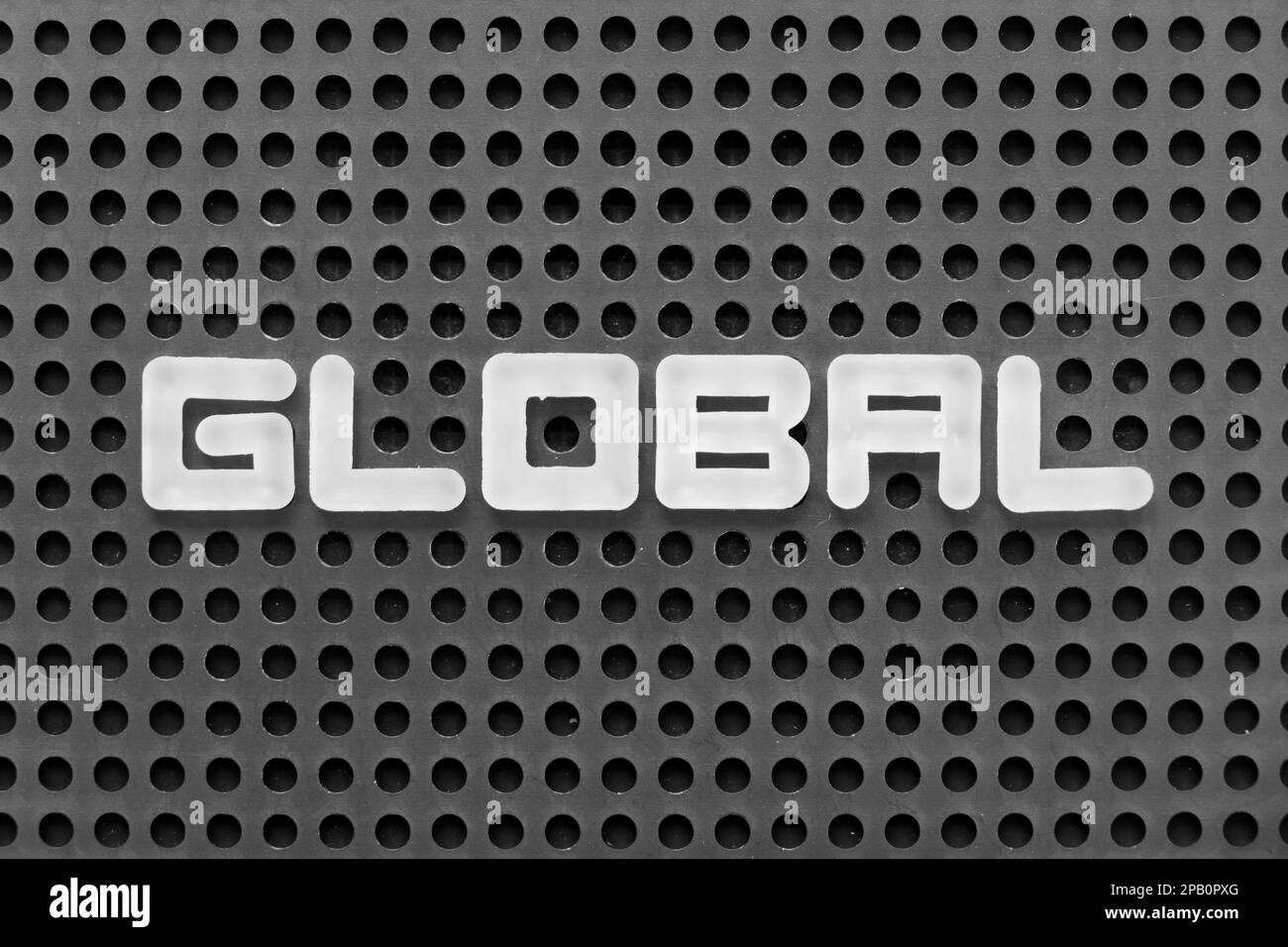 White alphabet letter in word global on black pegboard background Stock ...