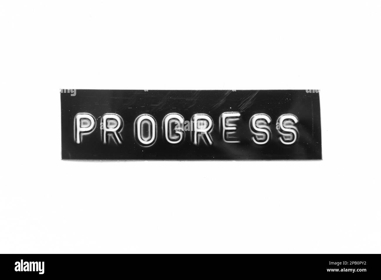 Black color banner that have embossed letter with word progress on ...