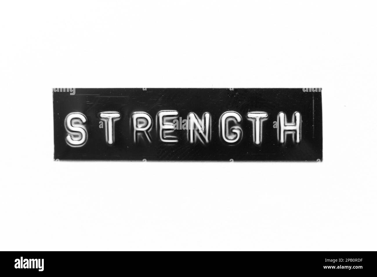 Black color banner that have embossed letter with word strength on ...