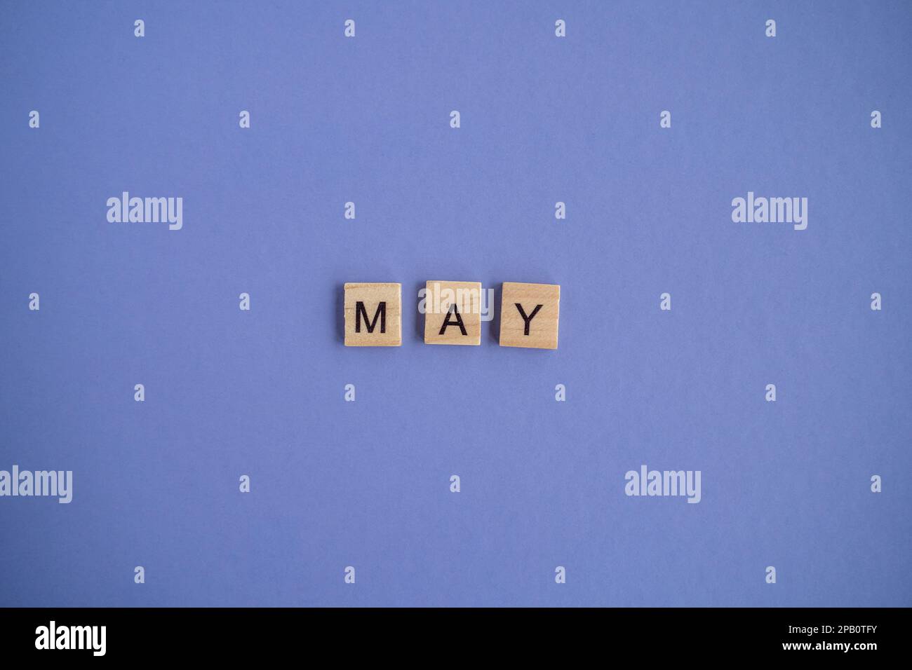 The name of the month MAY is written on wooden isolated cubes. Very ...