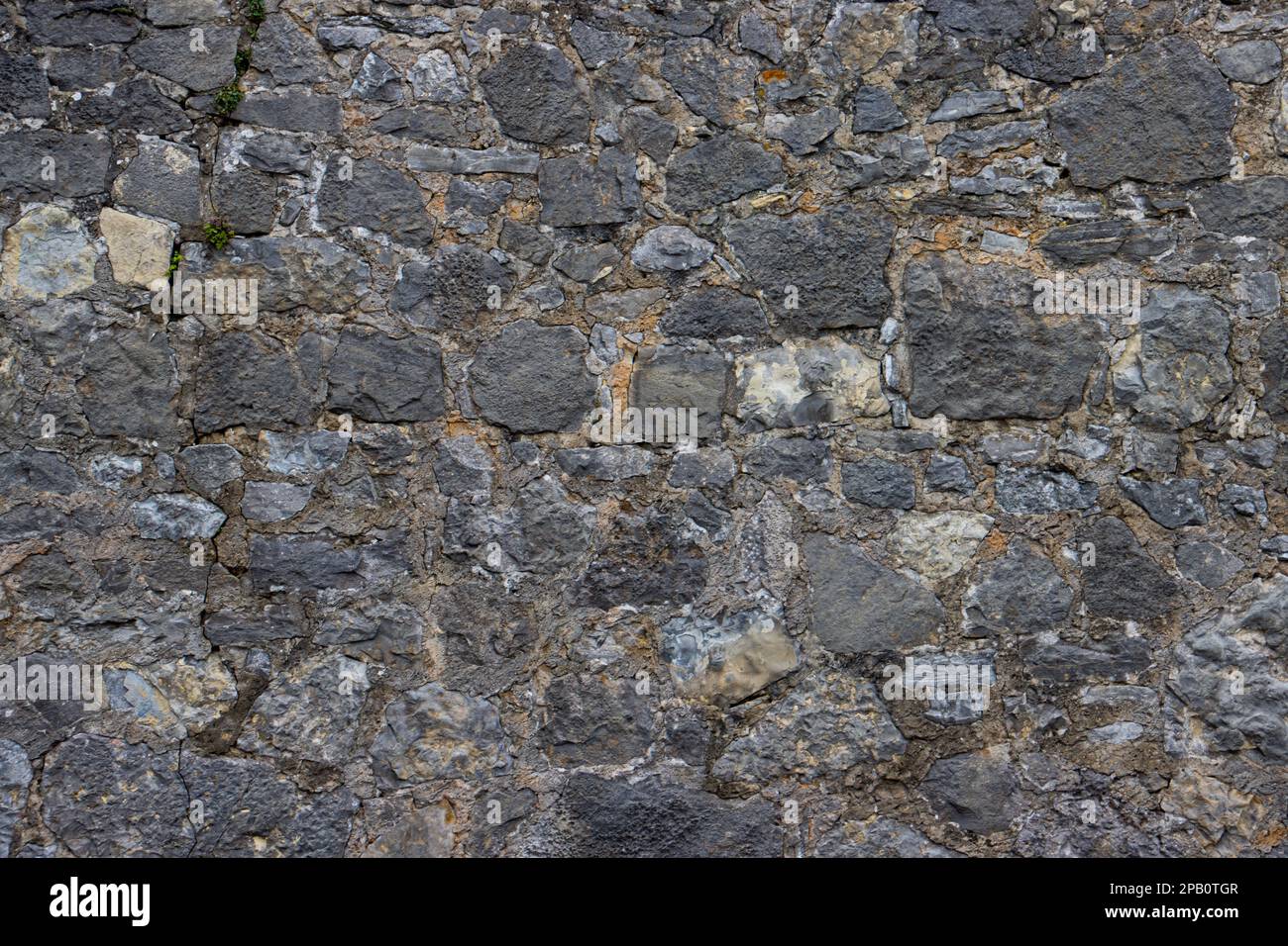 Natural stone wall background texture Stock Photo - Alamy