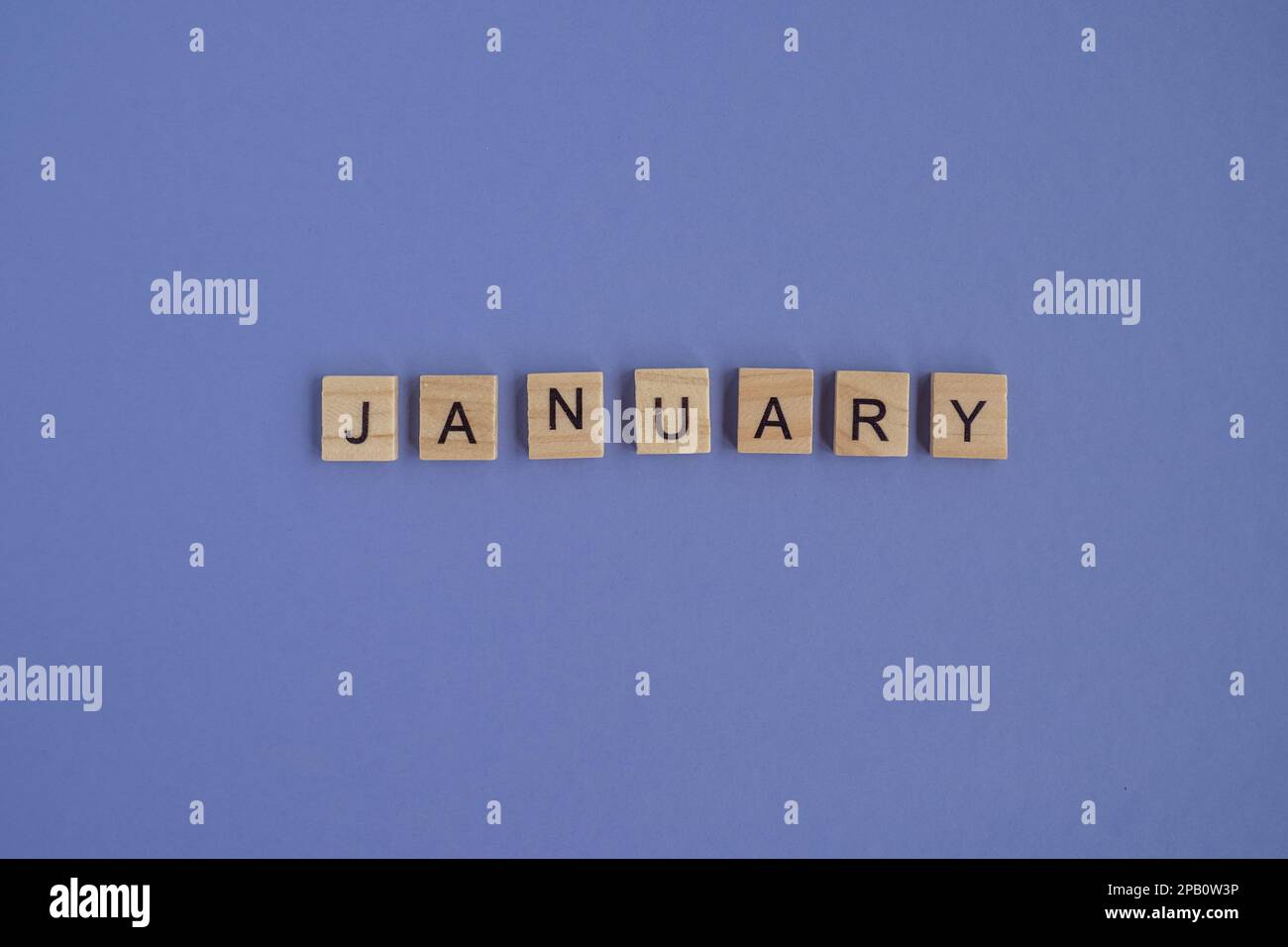 The name of the month of January is written on wooden cubes isolated ...