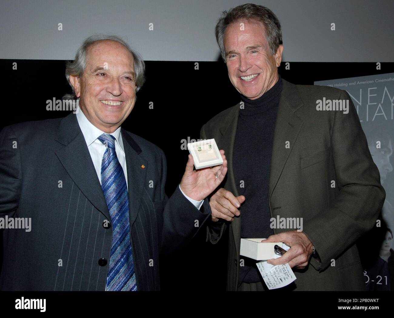 Actor Warren Beatty right, presents cinematographer Vittorio Storaro ...