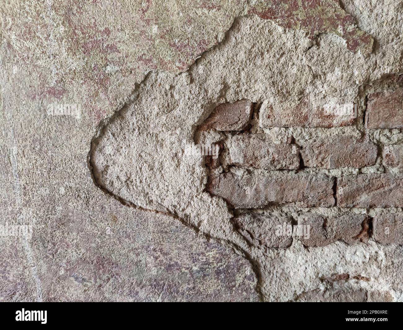 Texture of old brick wall with collapsed plaster. Background of shabby ...