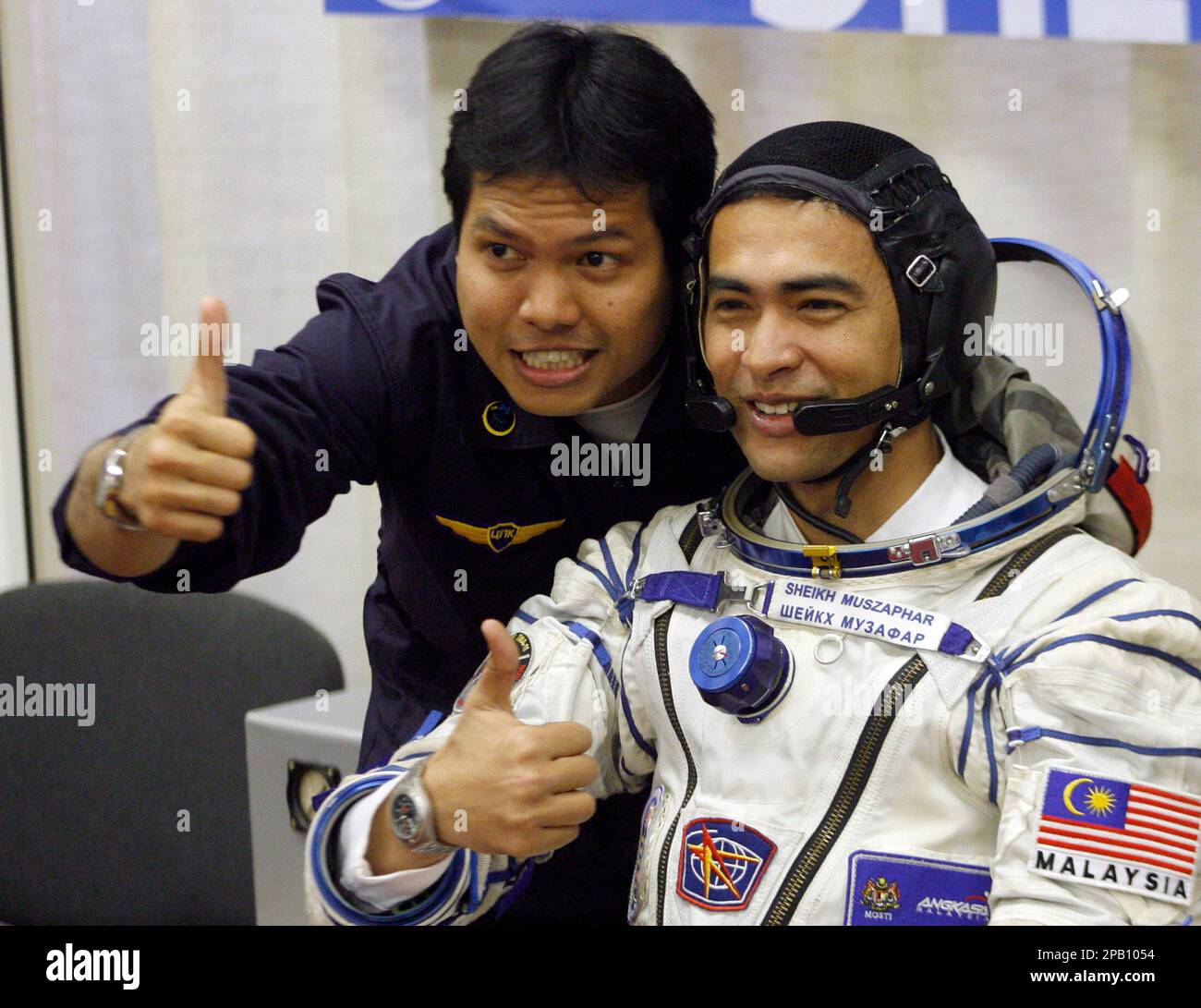 Sheikh Muszaphar Shukor of Malaysia, right, and Malaysia's back up crew ...