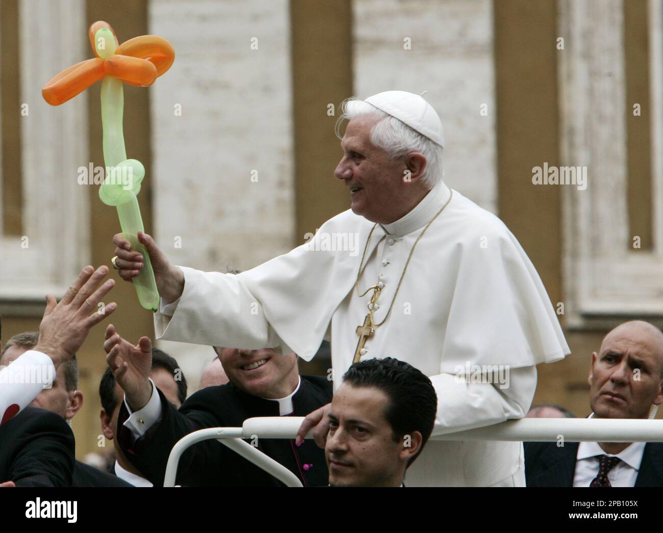 Pope Benedict XVI receives a flower made from balloons during the ...