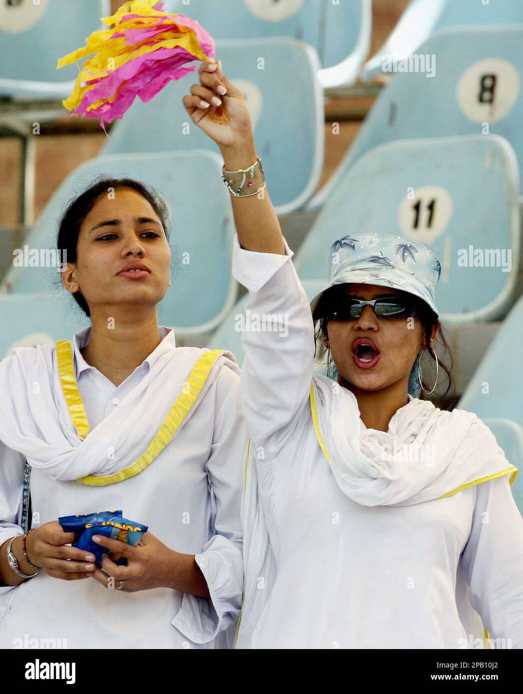 Pakistani girls cheer as they watch the second cricket test match ...