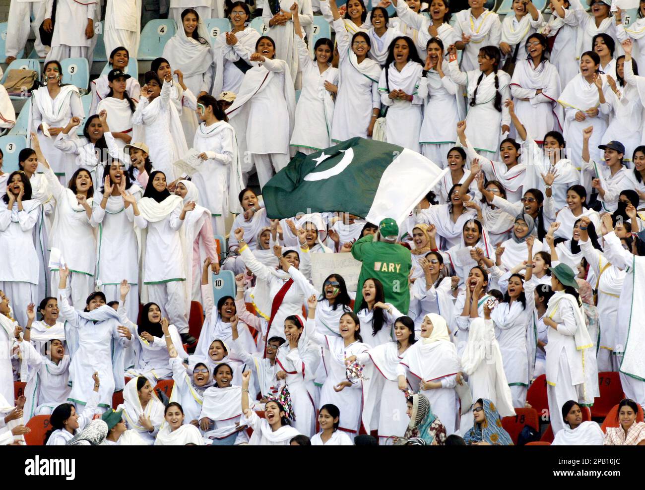 Pakistani girls cheer as they watch the second cricket test match ...