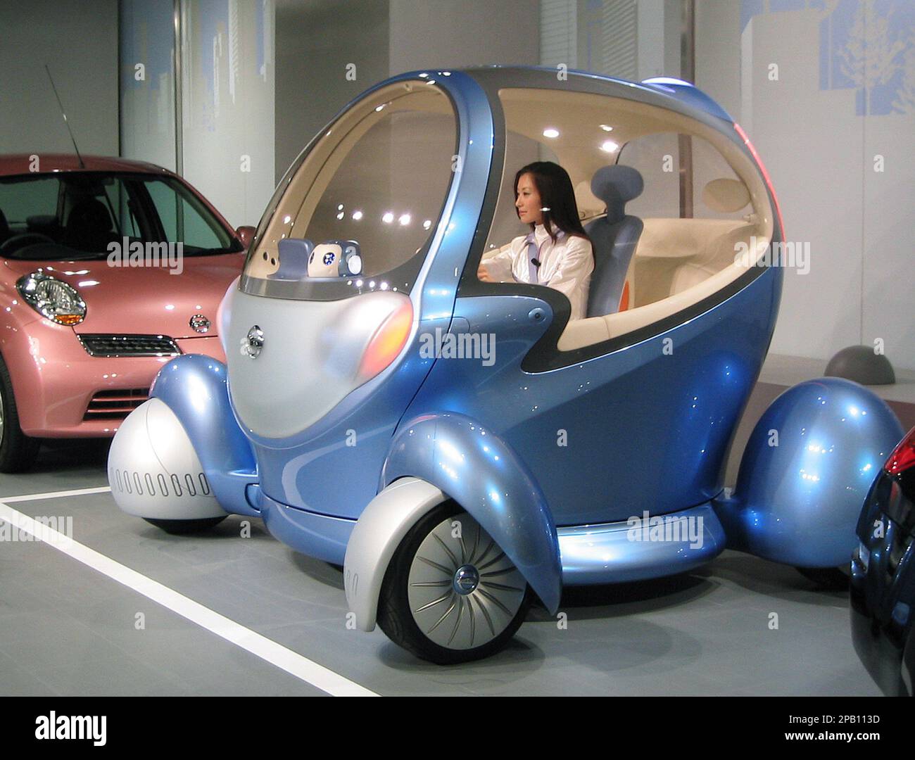 A Nissan staff tries to drive the Japanese auto maker's ball-shaped ...