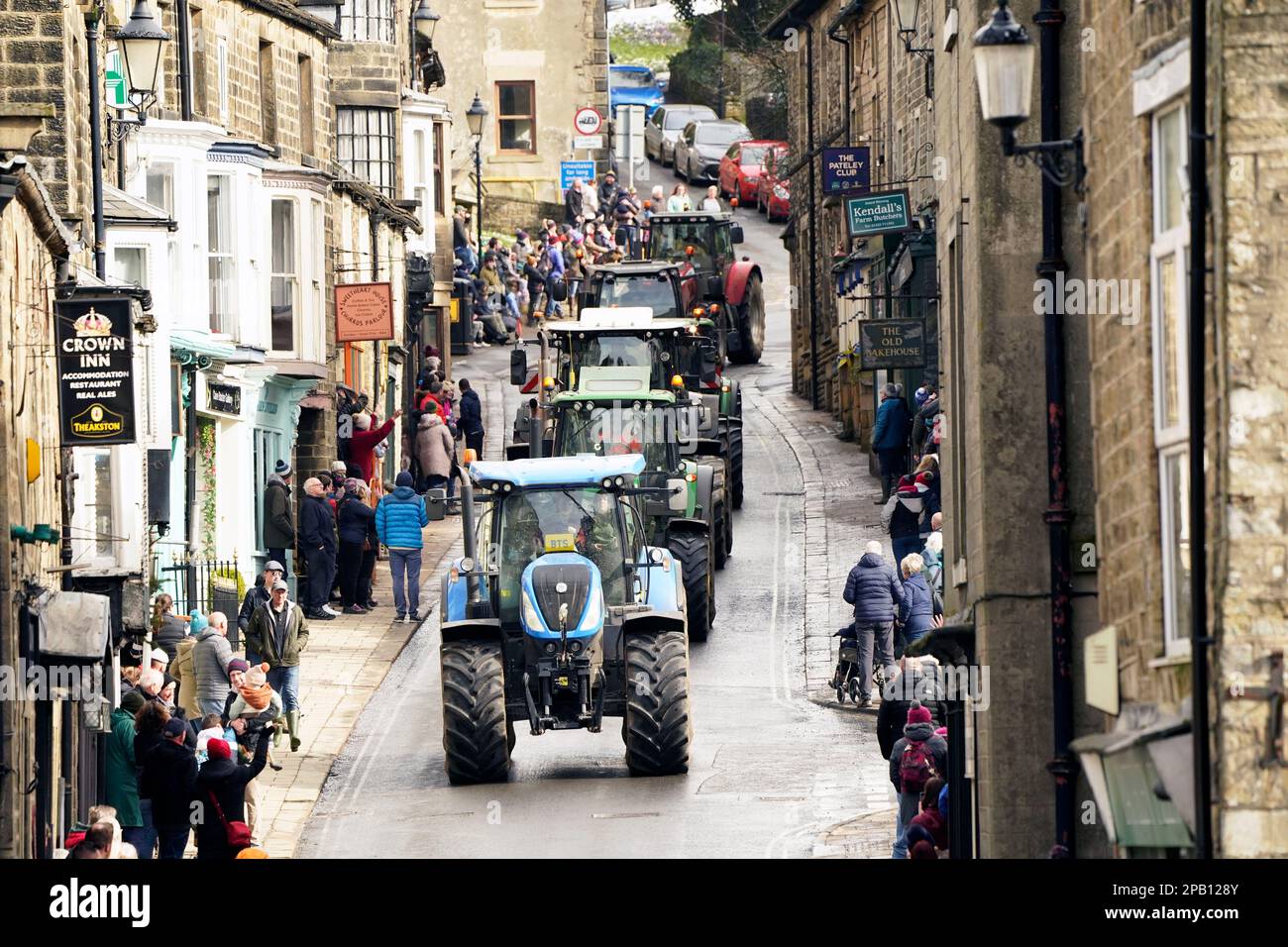 A convoy of tractors make their way through Pateley Bridge in North ...