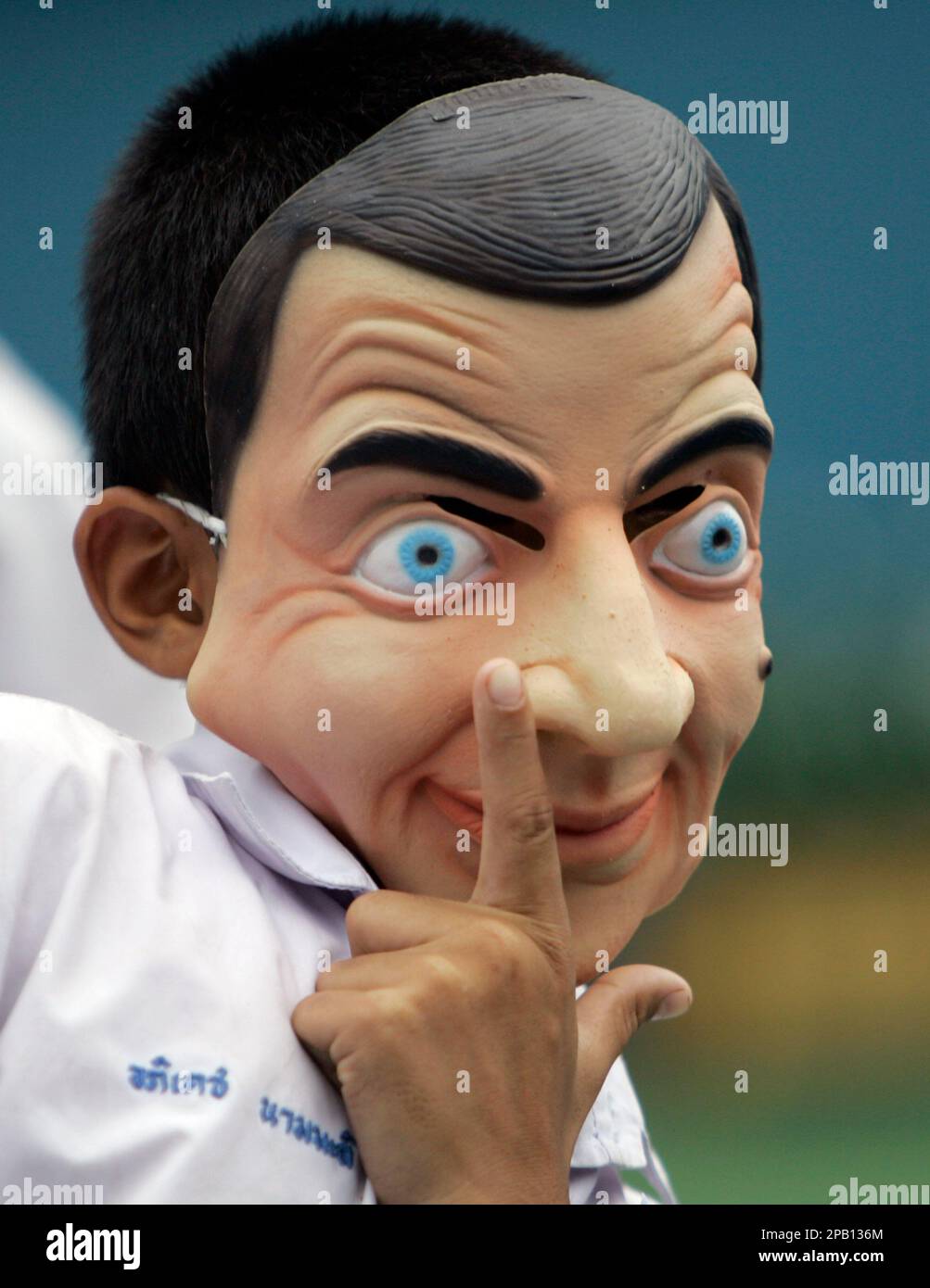 A Thai student wears a Mr. Bean mask at the PTT Bangkok Open tennis ...
