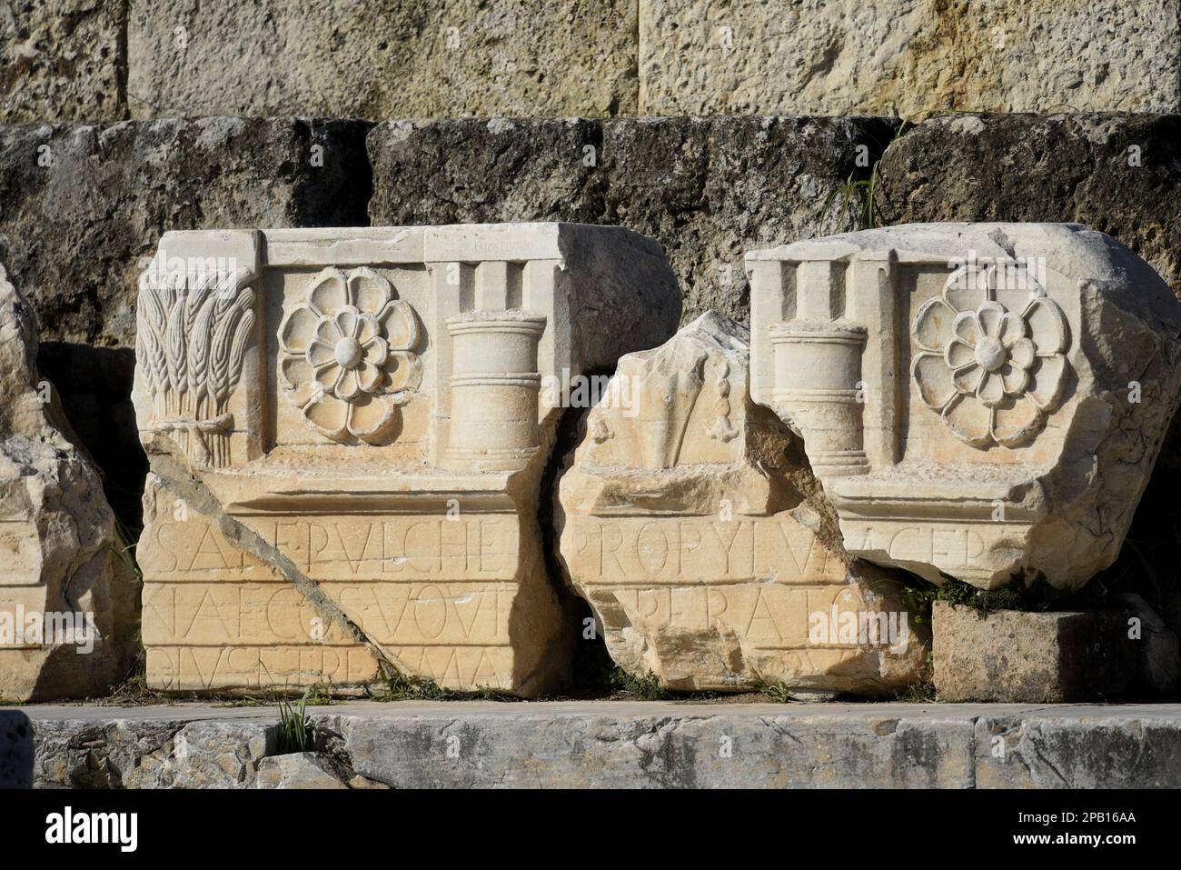 Ancient marble sculpted flower rosette and triune wheat at the ...