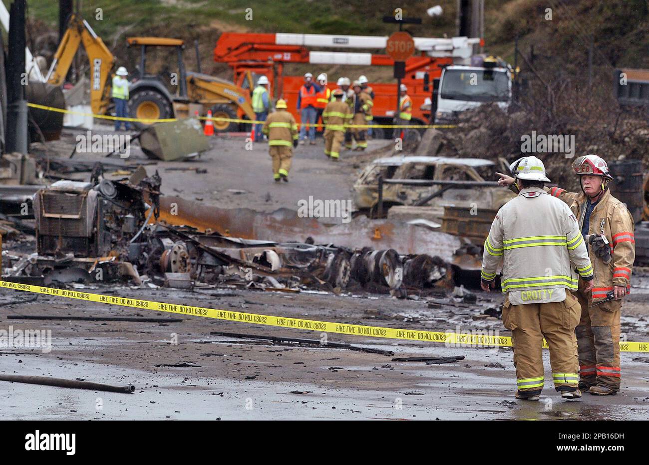 Firefighters share information Sunday afternoon, Oct. 7, 2007, in front ...