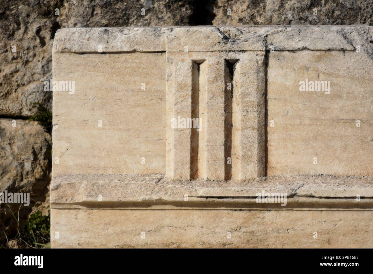 Ancient sculpted marble slab at the Archaeological Site of Eleusis in ...