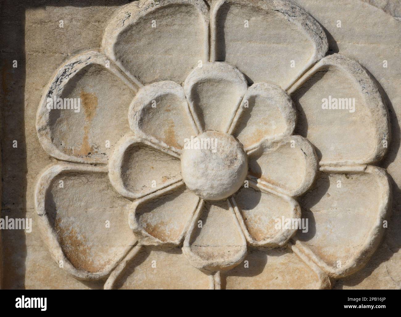 Ancient Greek marble sculpted flower rosette at the Sanctuary of ...