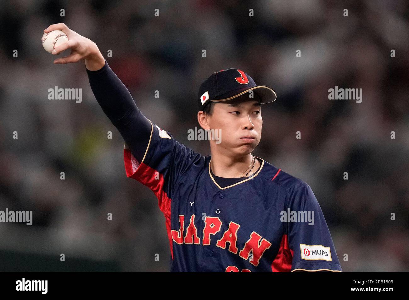 Atsuki Yuasa of Japan prepares to pitch to Australia in the 8th inning ...
