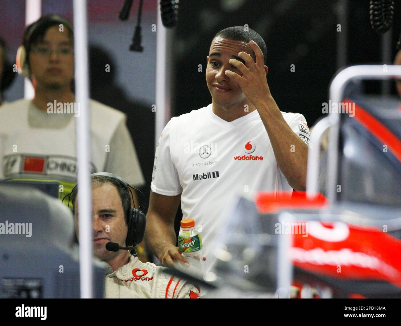British driver Lewis Hamilton stands in the McLaren-Mercedes garage ...