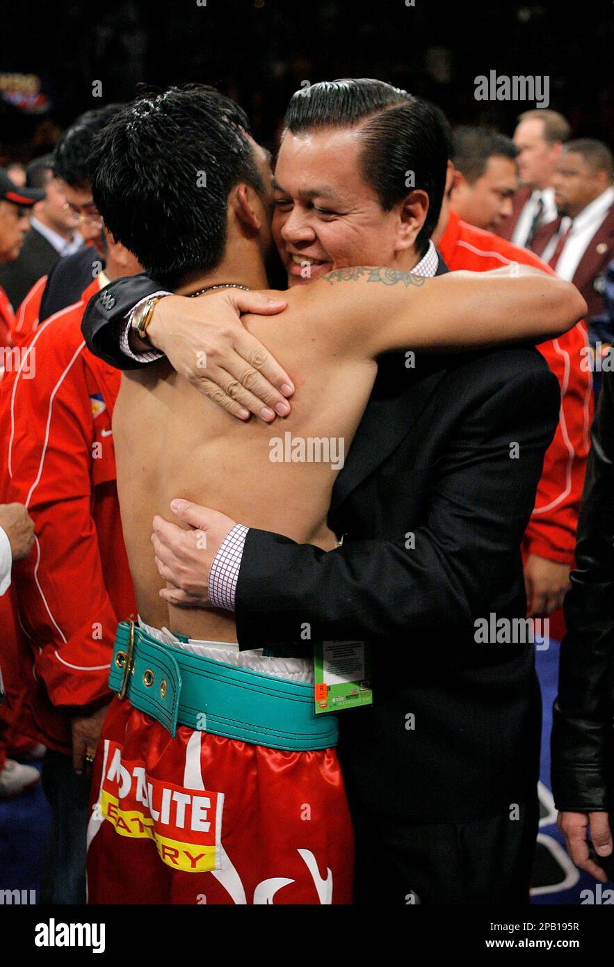 Boxer Manny Pacquiao, left, of the Philippines, gets a hug from Noli De ...
