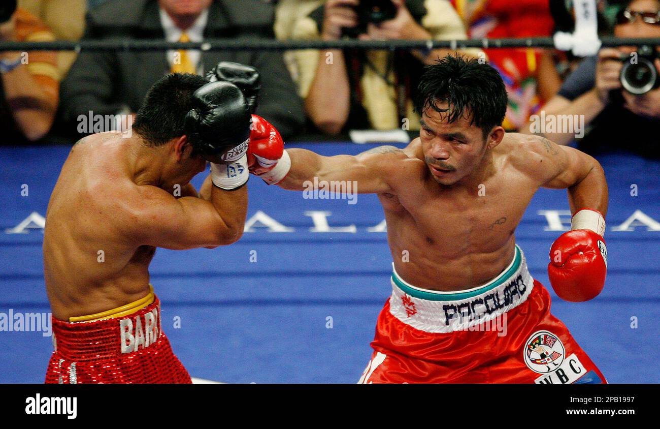 Manny Pacquiao of the Philippines punches Marco Antonio Barrera of ...