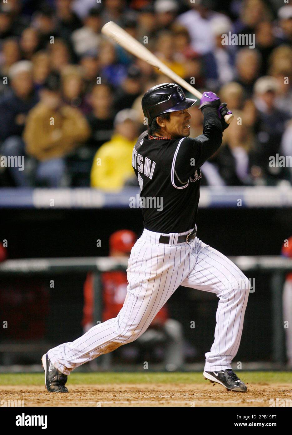 Colorado Rockies' Kazuo Matsui, of Japan, follows the flight of his RBI ...