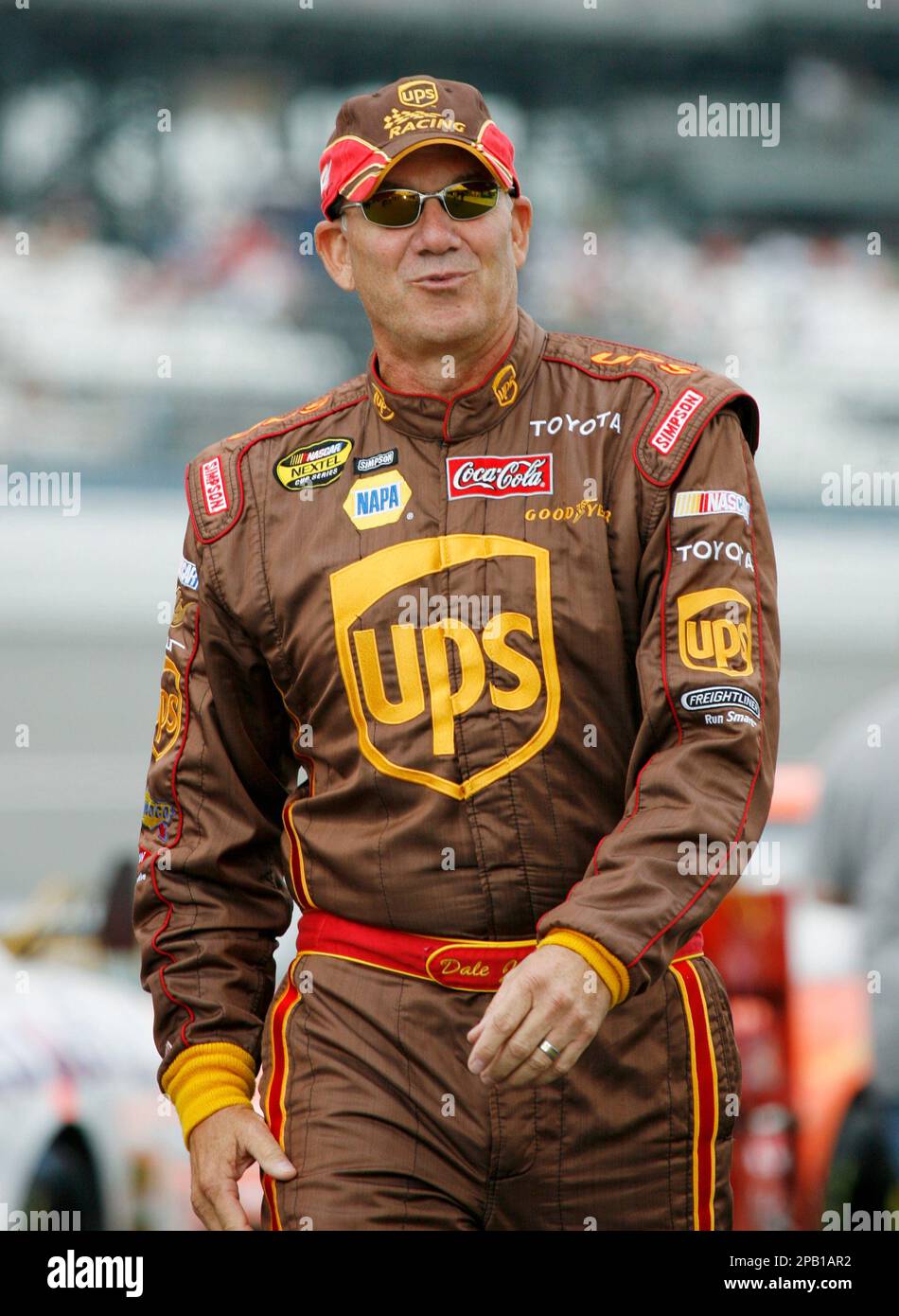 Dale Jarrett walks along the pits during qualifying for the NASCAR UAW ...