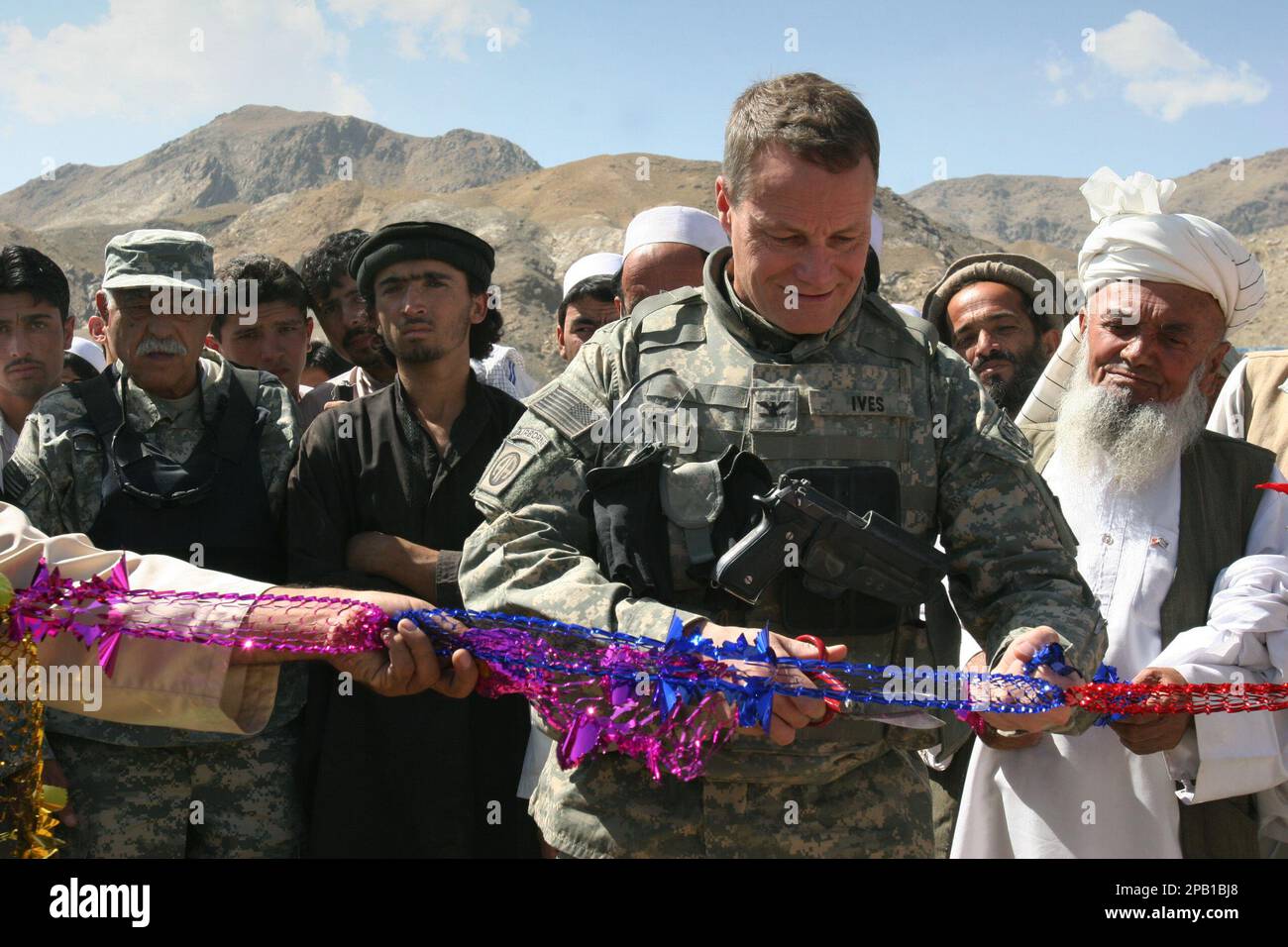 U.S. Col. Jonathan Ives inaugurates a library at a school in Tagab ...
