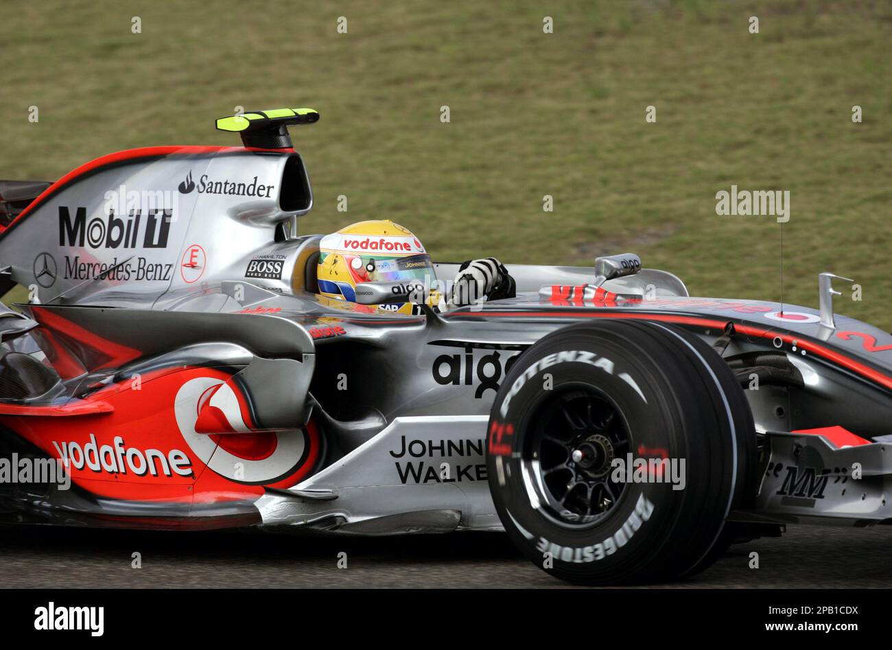 British Lewis Hamilton steers his McLaren-Mercedes on his way to taking ...