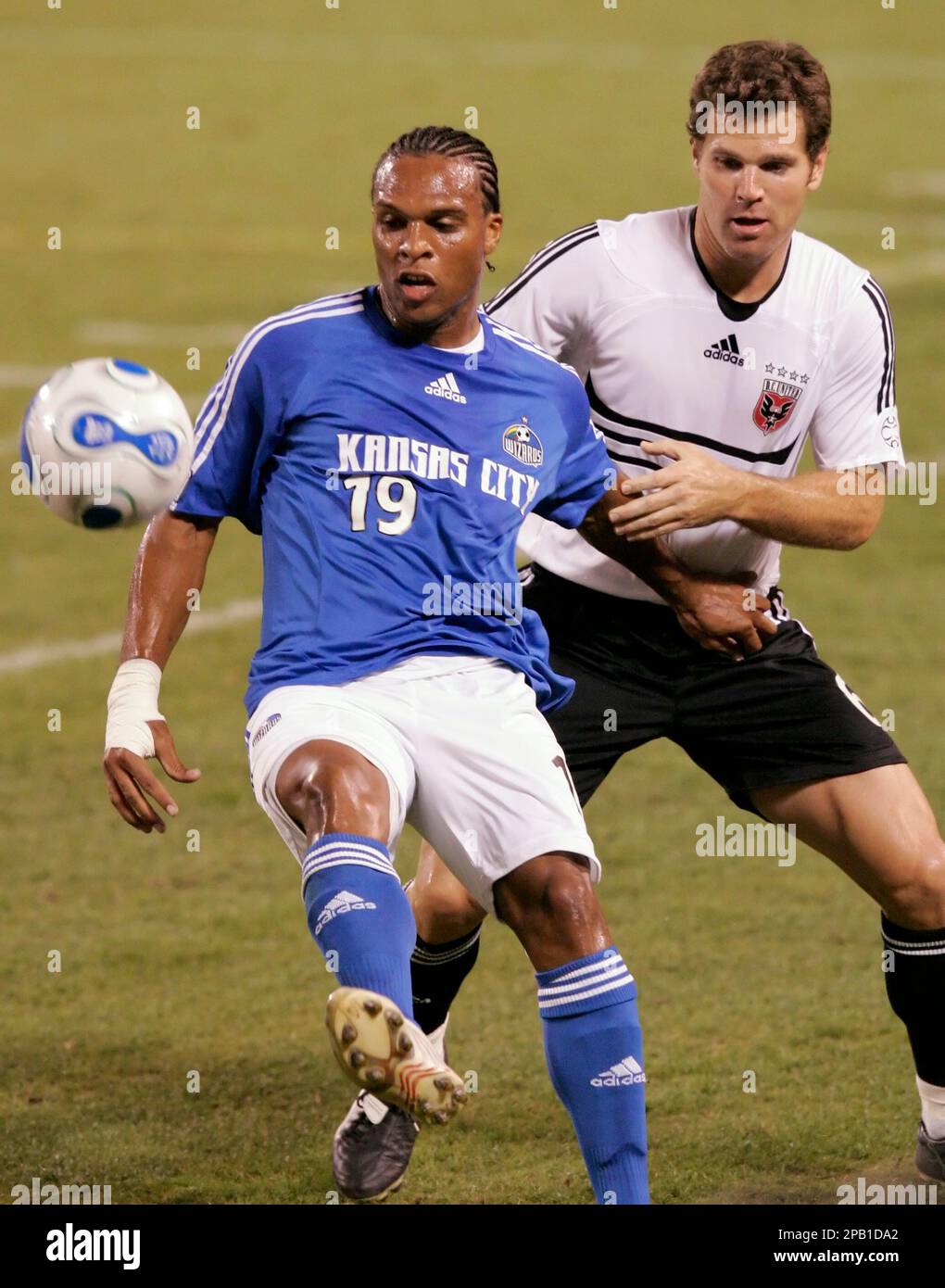Kansas City Wizards' Scott Sealy (19) works to control the ball in front of D.C. United's Greg ...