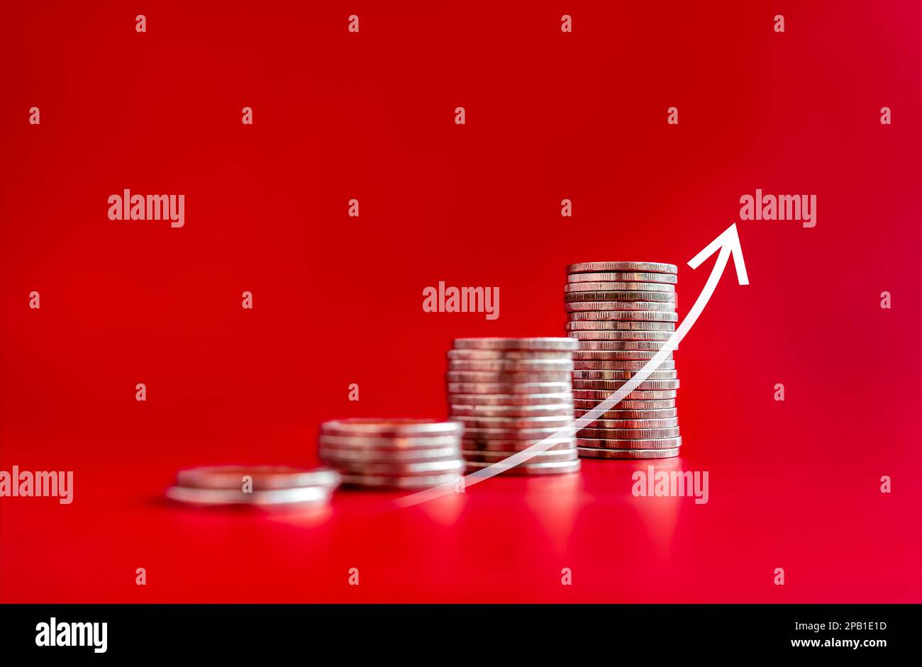 Rising arrow growing on coin stacks as graph chart steps isolated on ...
