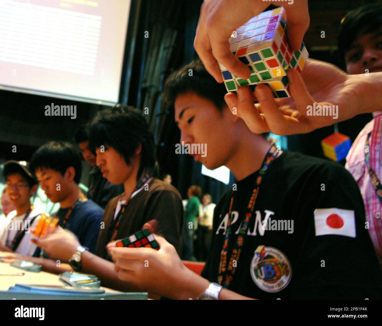 Players of Japan practice to solve the Rubik's cube during the ...